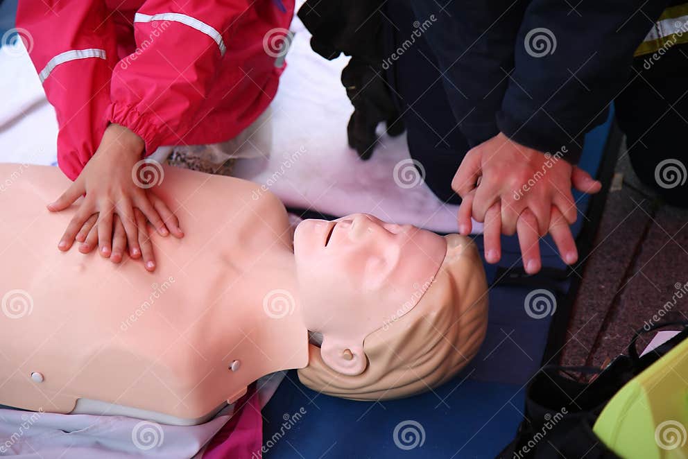 Practicing CPR Chest Compressioon on a Dummy Stock Image - Image of ...