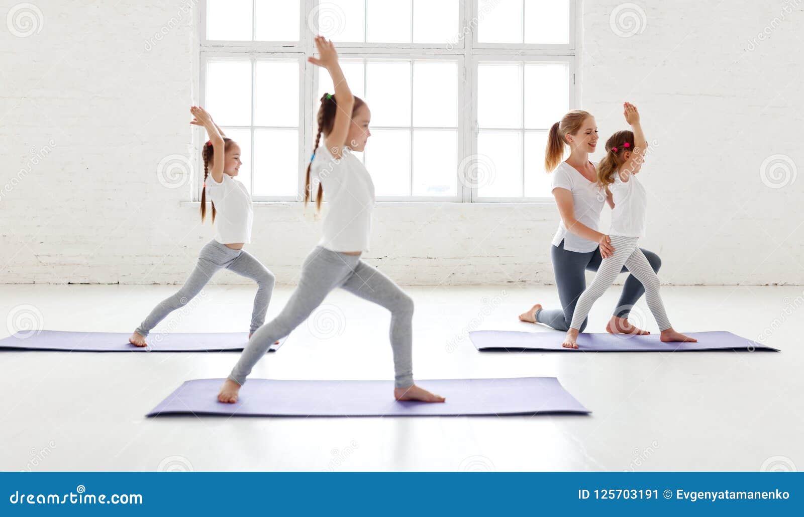 Practicing Engaged in Gymnastics and Yoga with Teacher Stock Image ...