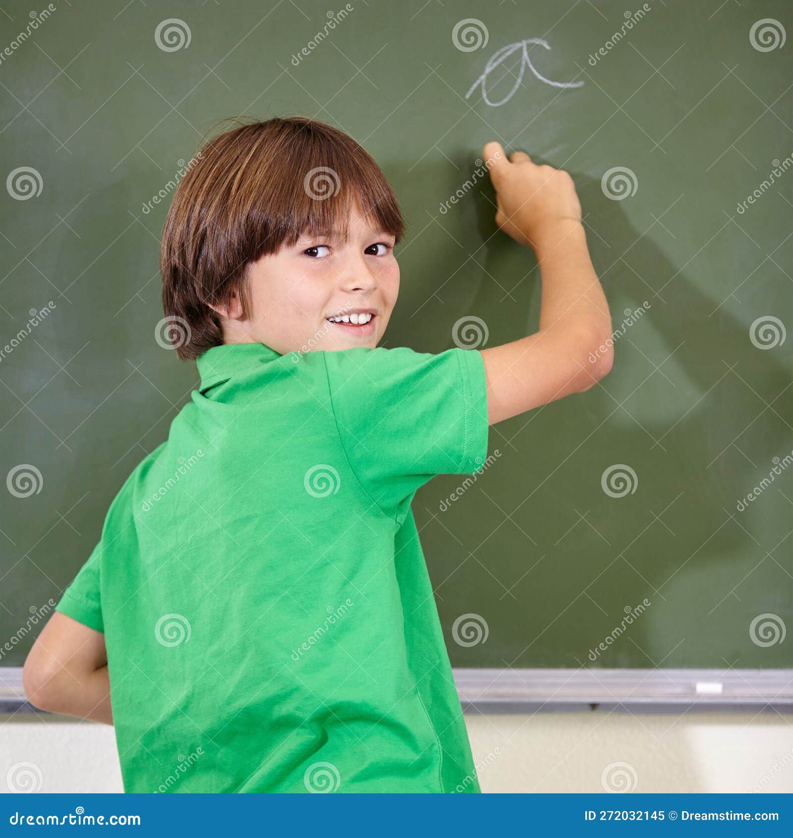 Practicing His Handwriting. a Little Boy Writing on the Blackboard ...