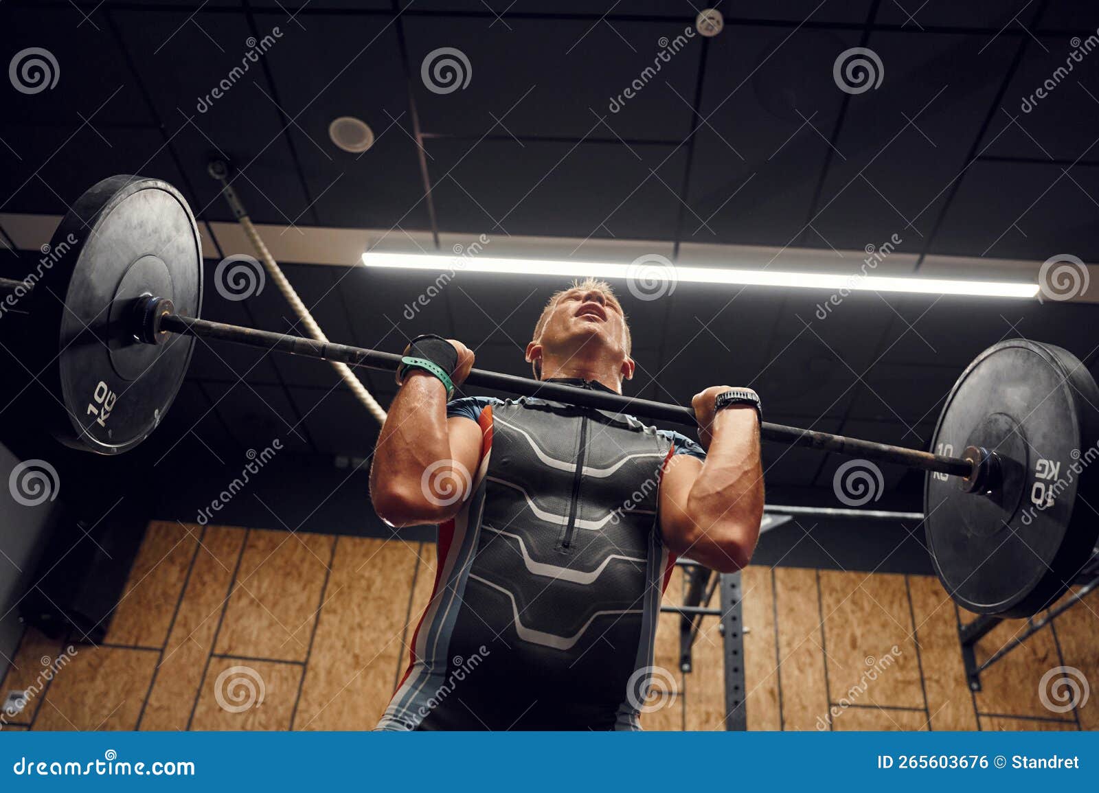 Practicing Process. Strong Man is Lifting Barbell in the Gym Stock ...