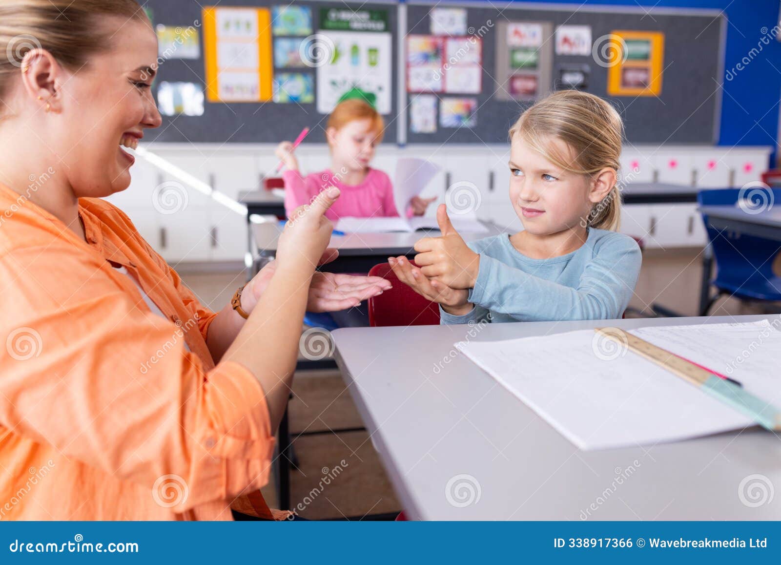Practicing Sign Language, Female Teacher and Student in School ...