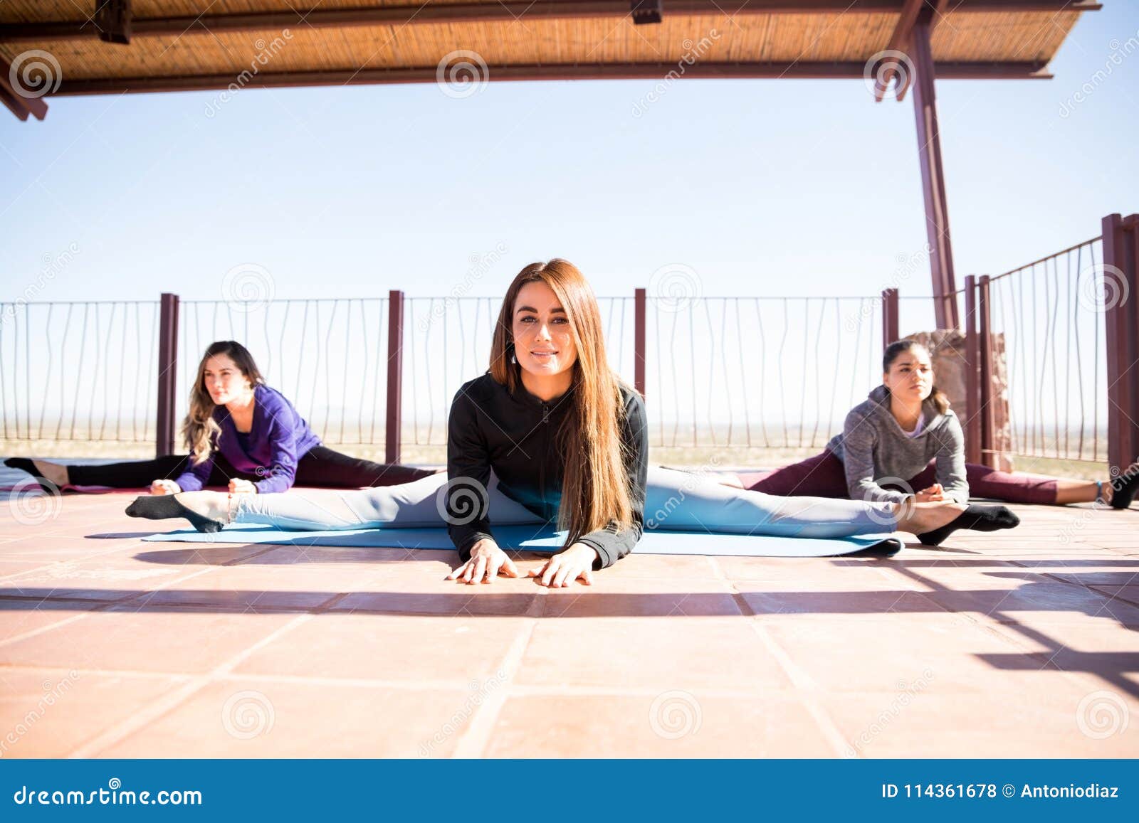 Practising Leg Splits at a Yoga Class Stock Photo - Image of flexible ...