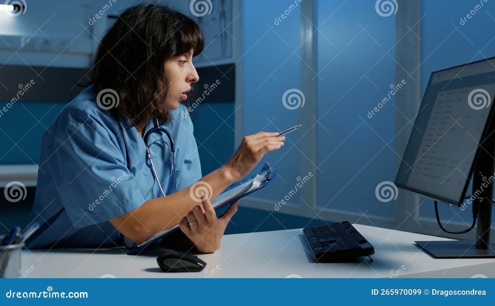 Practitioner Assistant with Blue Uniform and Stethoscope Analyzing ...