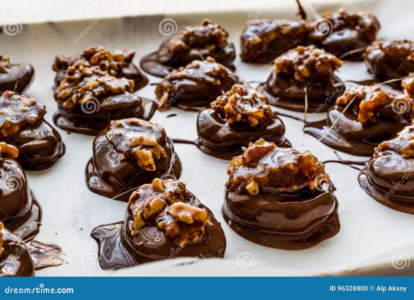 Praline Chocolate with Walnut, Almond, Peanut or Croquant Stock Photo ...
