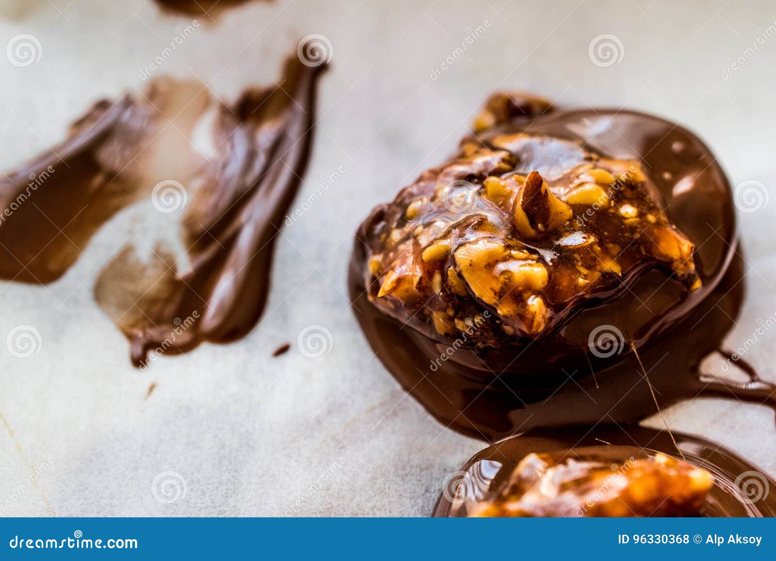 Praline Chocolate with Walnut, Almond, Peanut or Croquant Stock Photo ...