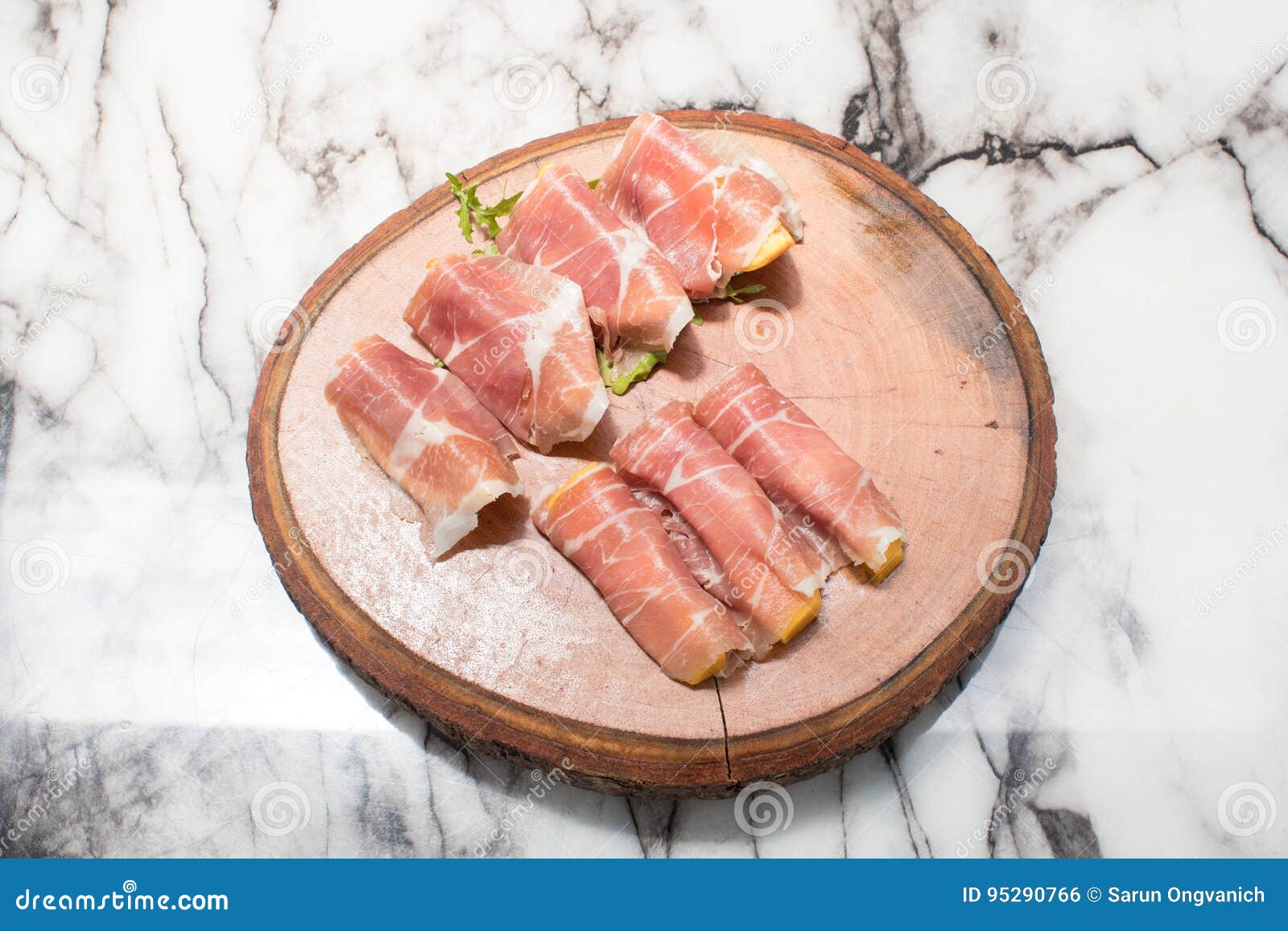 Prama Rolls on a Wooden Plate Stock Photo - Image of meat, parma: 95290766