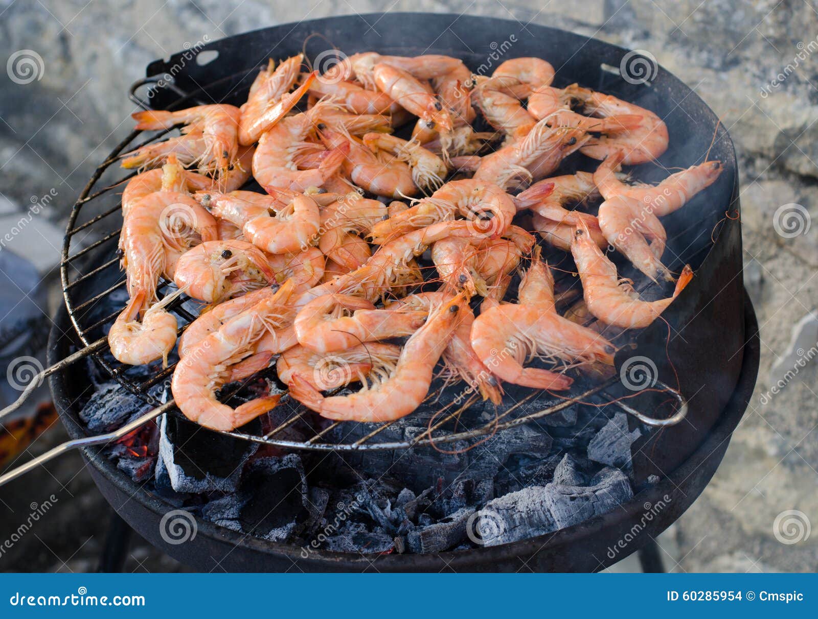 Prawns cooking on a BBQ stock photo. Image of grilling - 60285954