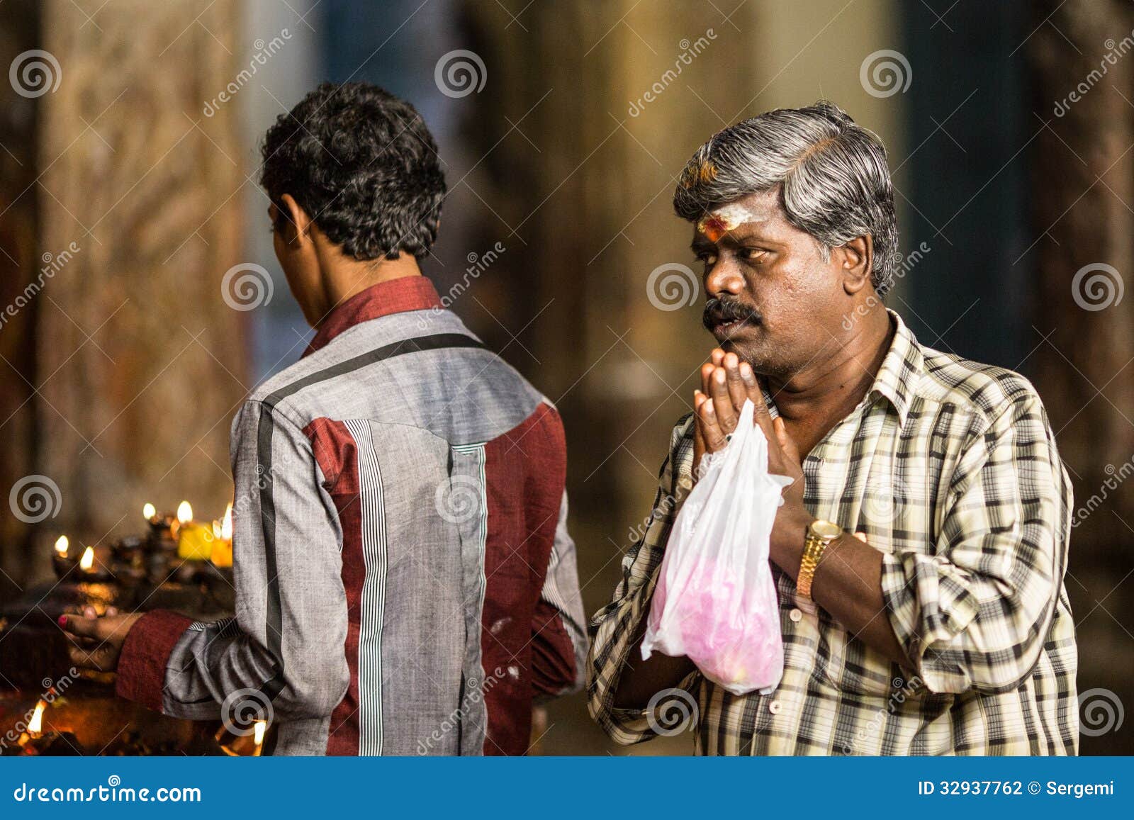A Prayer in the Indian Temple Editorial Photography - Image of temple ...