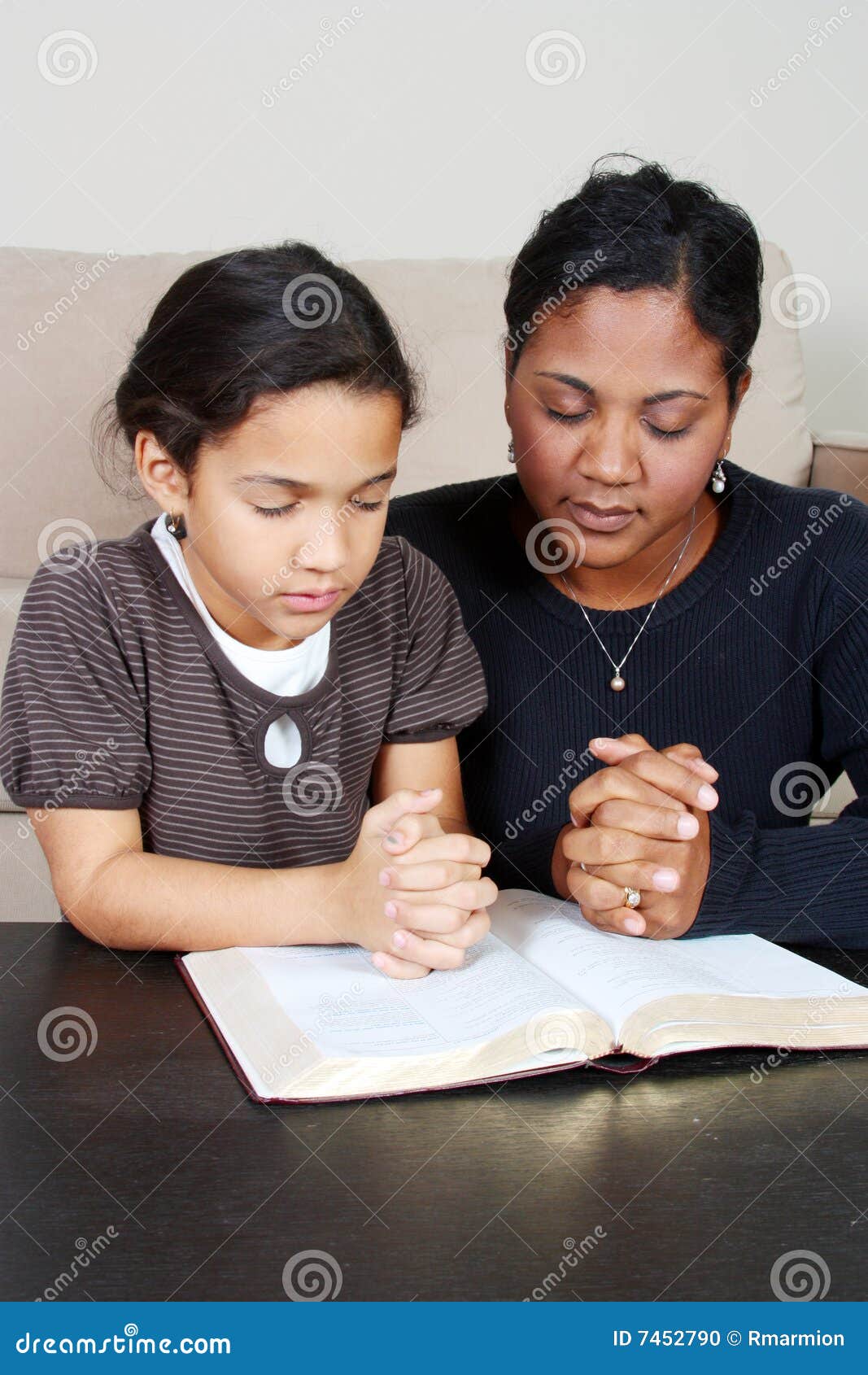 Hispanic Family Praying Together