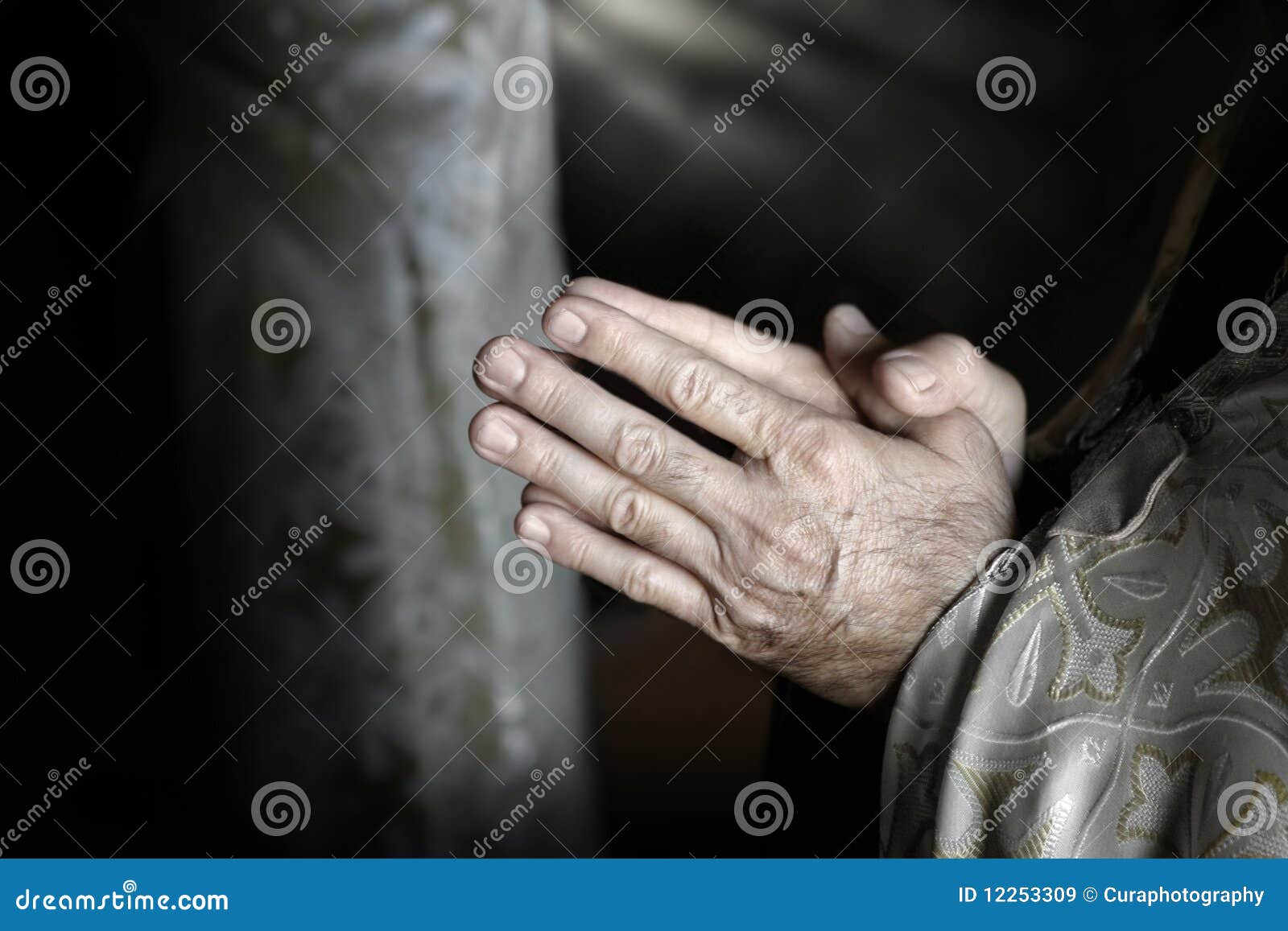Praying hands stock image. Image of catholic, robe, pleading - 12253309