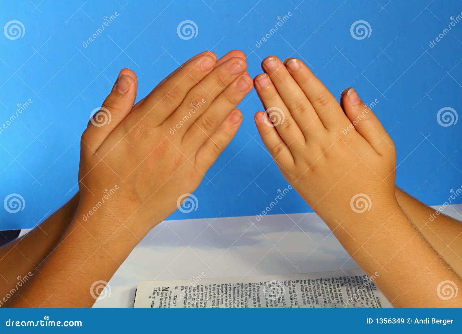 Praying hands on blue stock image. Image of christ, people - 1356349