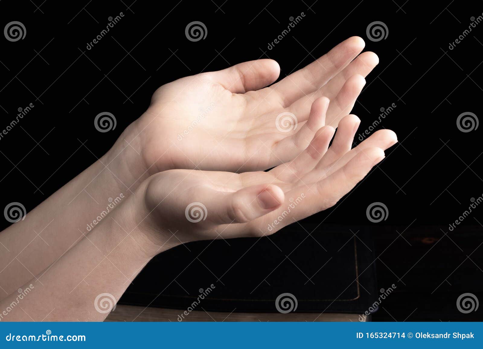 Praying Hands is in the Dark with Light on the Hands Stock Photo ...