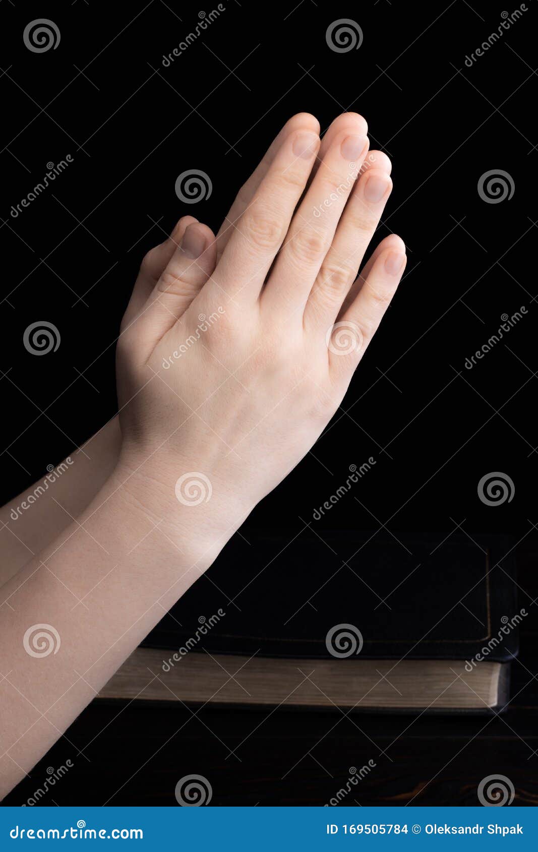 Praying Hands is in the Dark with Light on the Hands Stock Photo ...