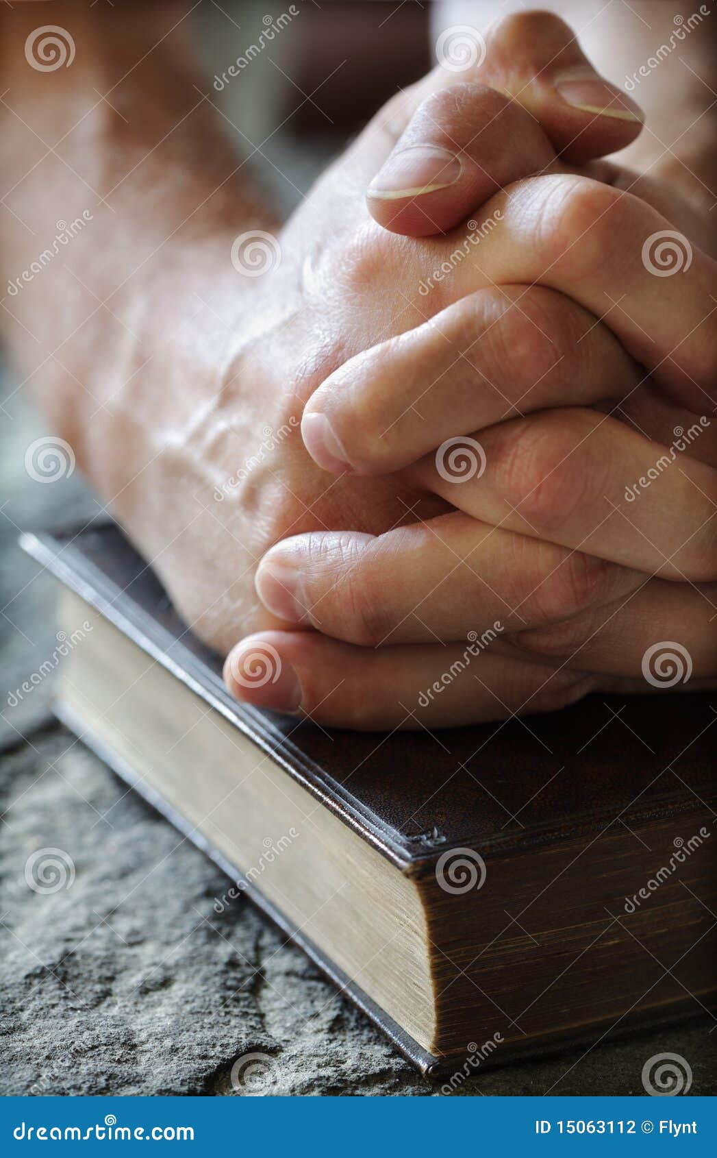 Praying Hands on a Holy Bible Stock Photo - Image of christianity ...