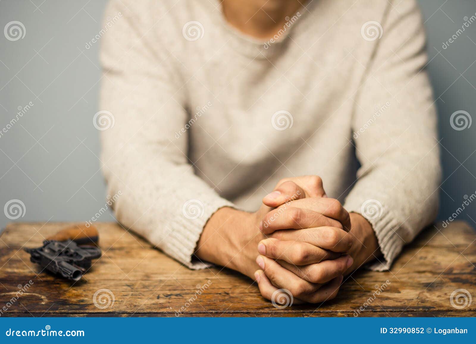 Praying man with a gun stock photo. Image of firearm - 32990852