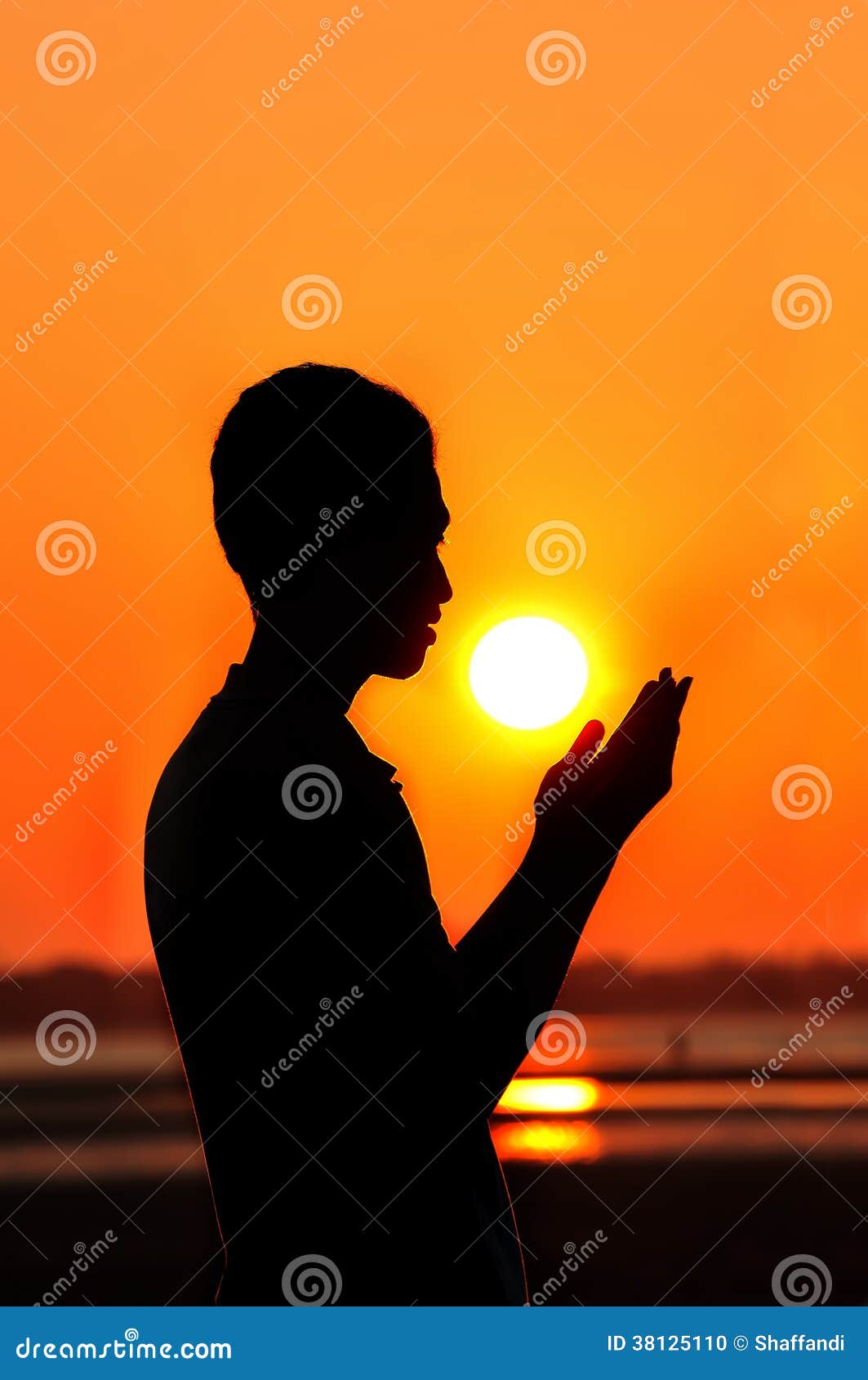 Praying at sunset stock photo. Image of morning, honest - 38125110