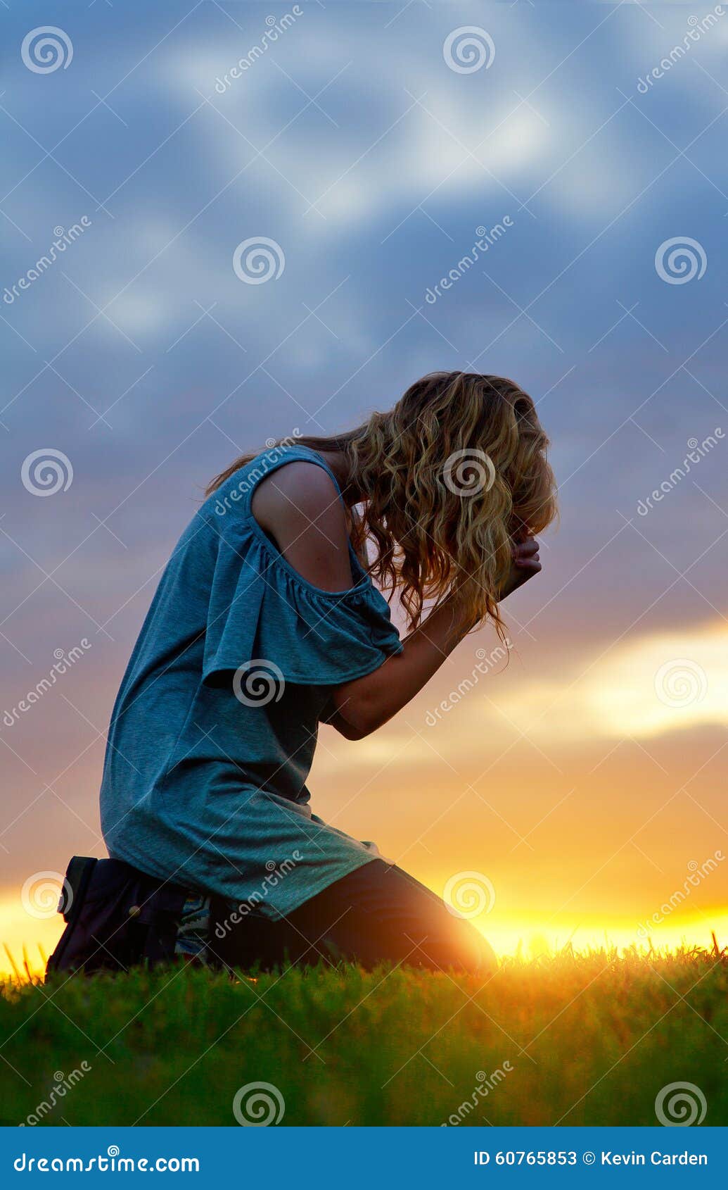 Praying at sunset stock image. Image of nature, prayer - 60765853