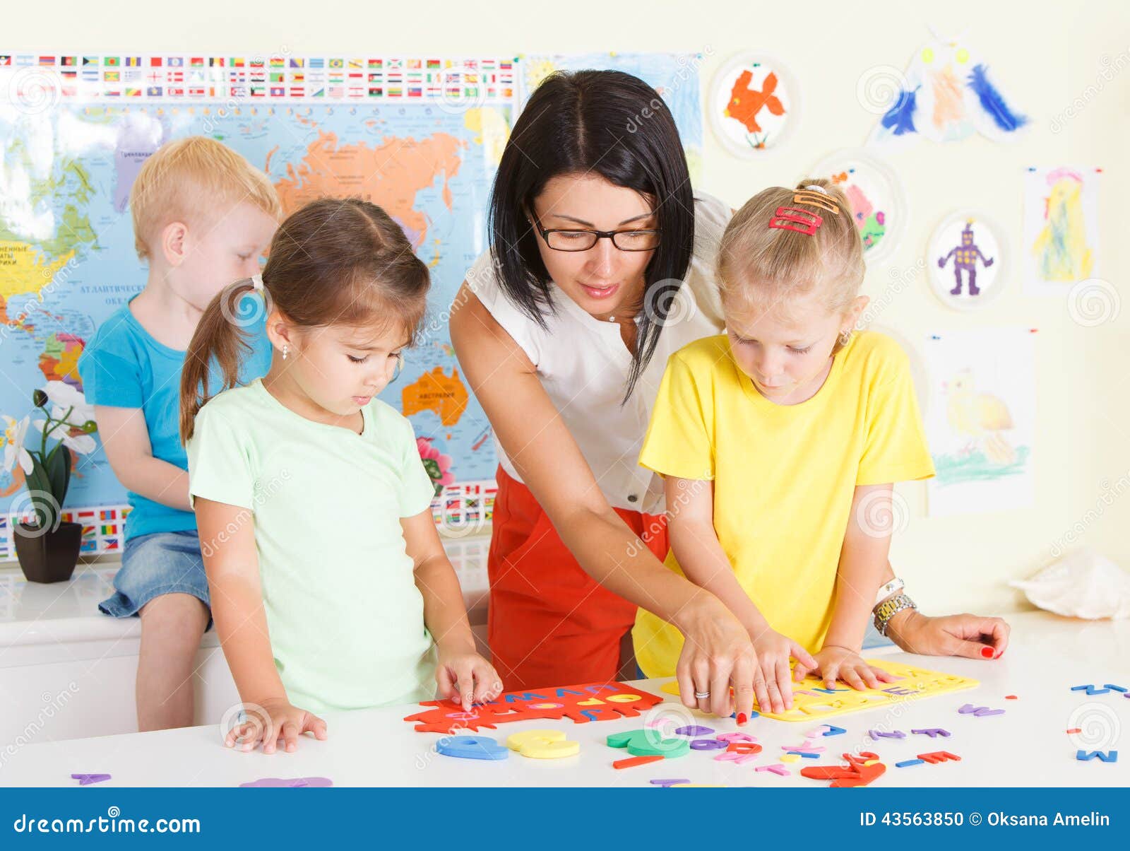 Pre-schoolers in the Classroom with a Teacher Stock Photo - Image of ...