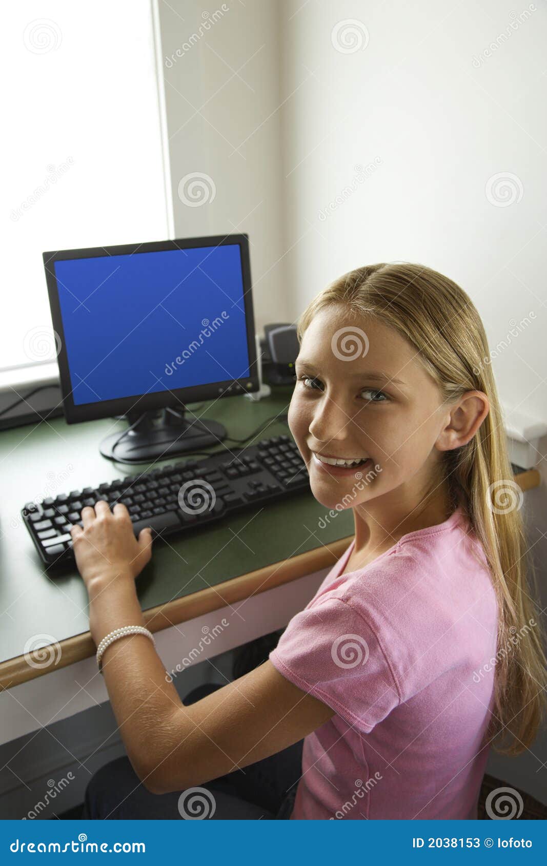Pre-teen Girl at Computer Smiling. Stock Image - Image of space ...