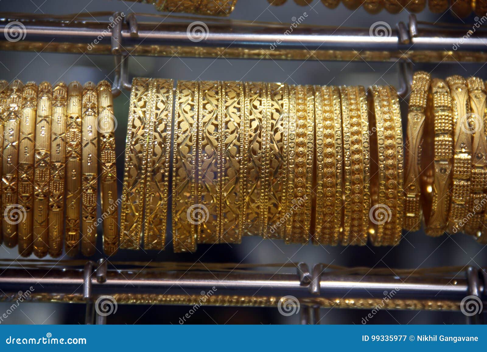 Precious Gold Bangles stock image. Image of artistry - 99335977