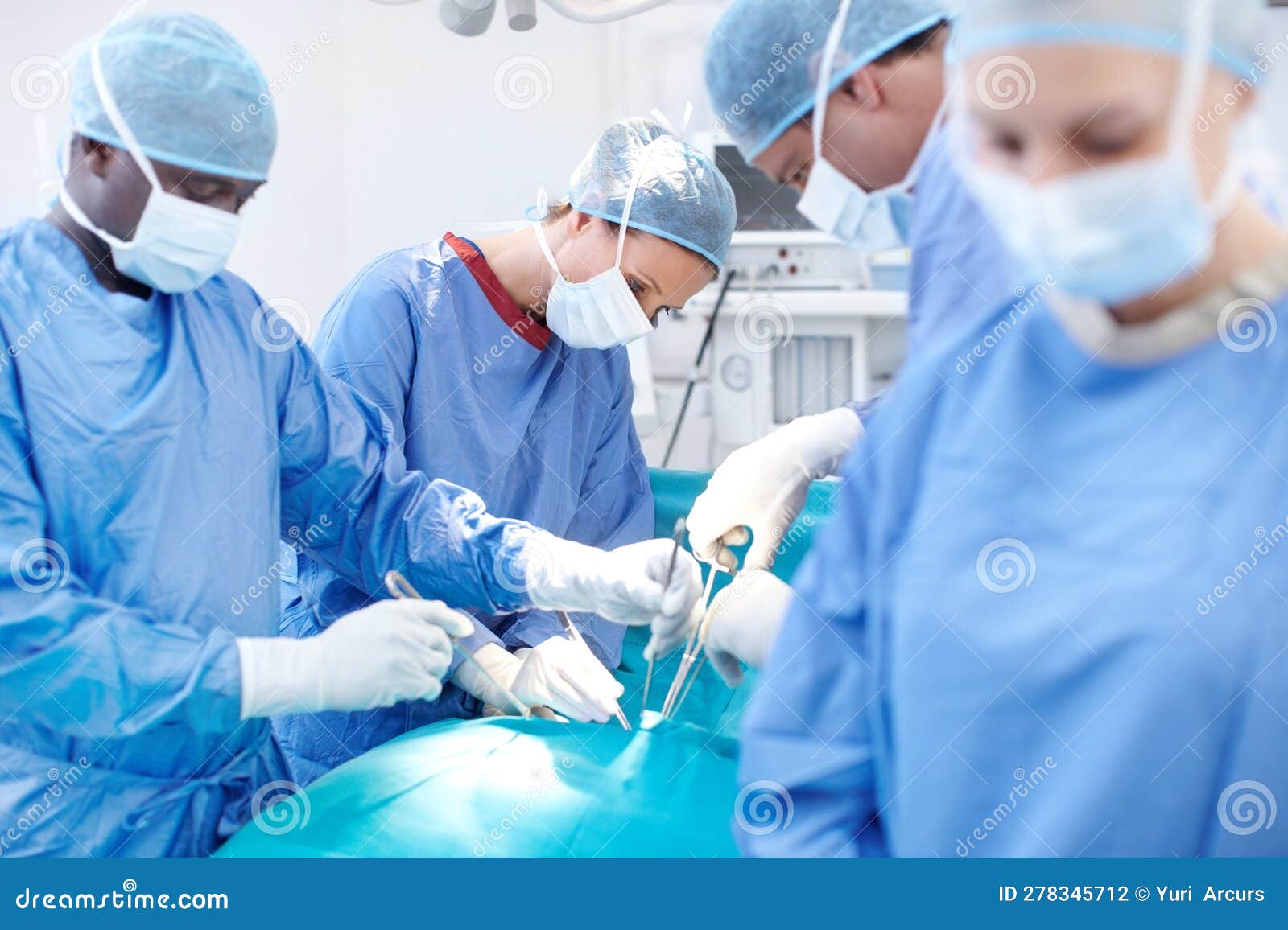 We are Precise and Accurate Under Pressure. Group of Surgeons Working ...
