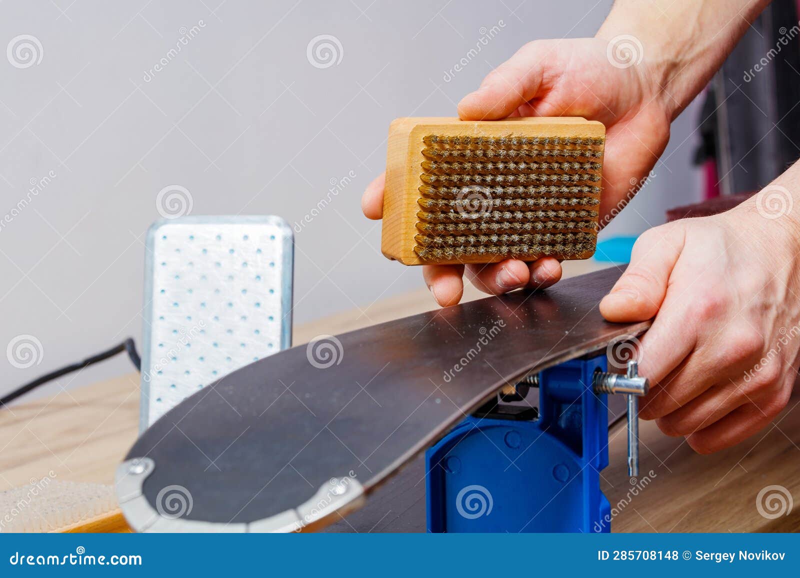 Precise Cleaning of Alpine Ski Base by Man in Workshop Stock Photo ...