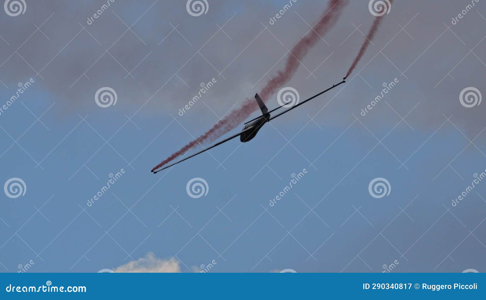 Precision in Flight Glider Performing a Four-Point Roll with Wingtip ...