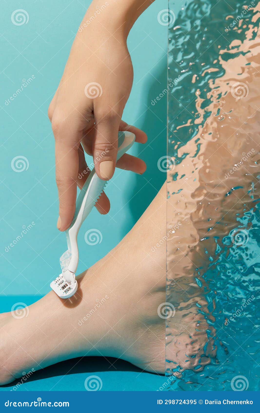Precision in Hand: a Razor Held Against a Striking Blue Backdrop ...