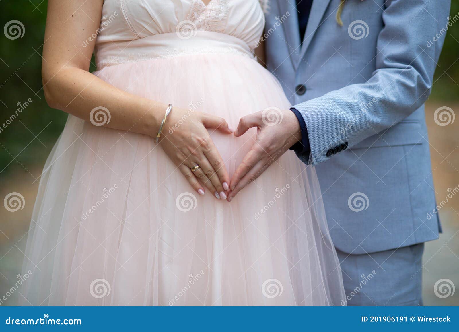 Pregnant Bride with the Groom on Their Wedding Day Stock Image - Image ...