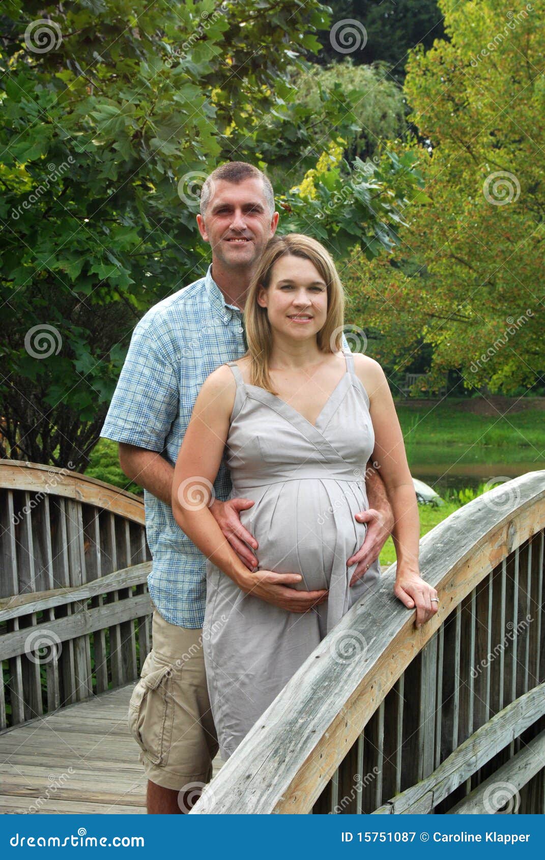 Pregnant Couple on a Bridge Stock Image - Image of dress, beautiful ...