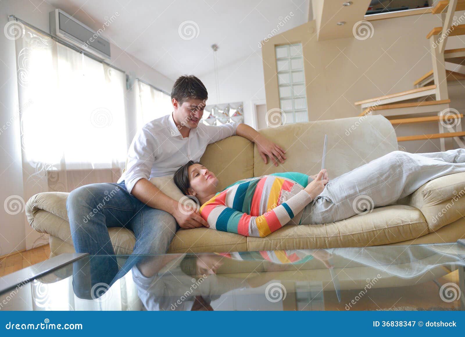Pregnant Couple at Home Using Tablet Computer Stock Image - Image of ...
