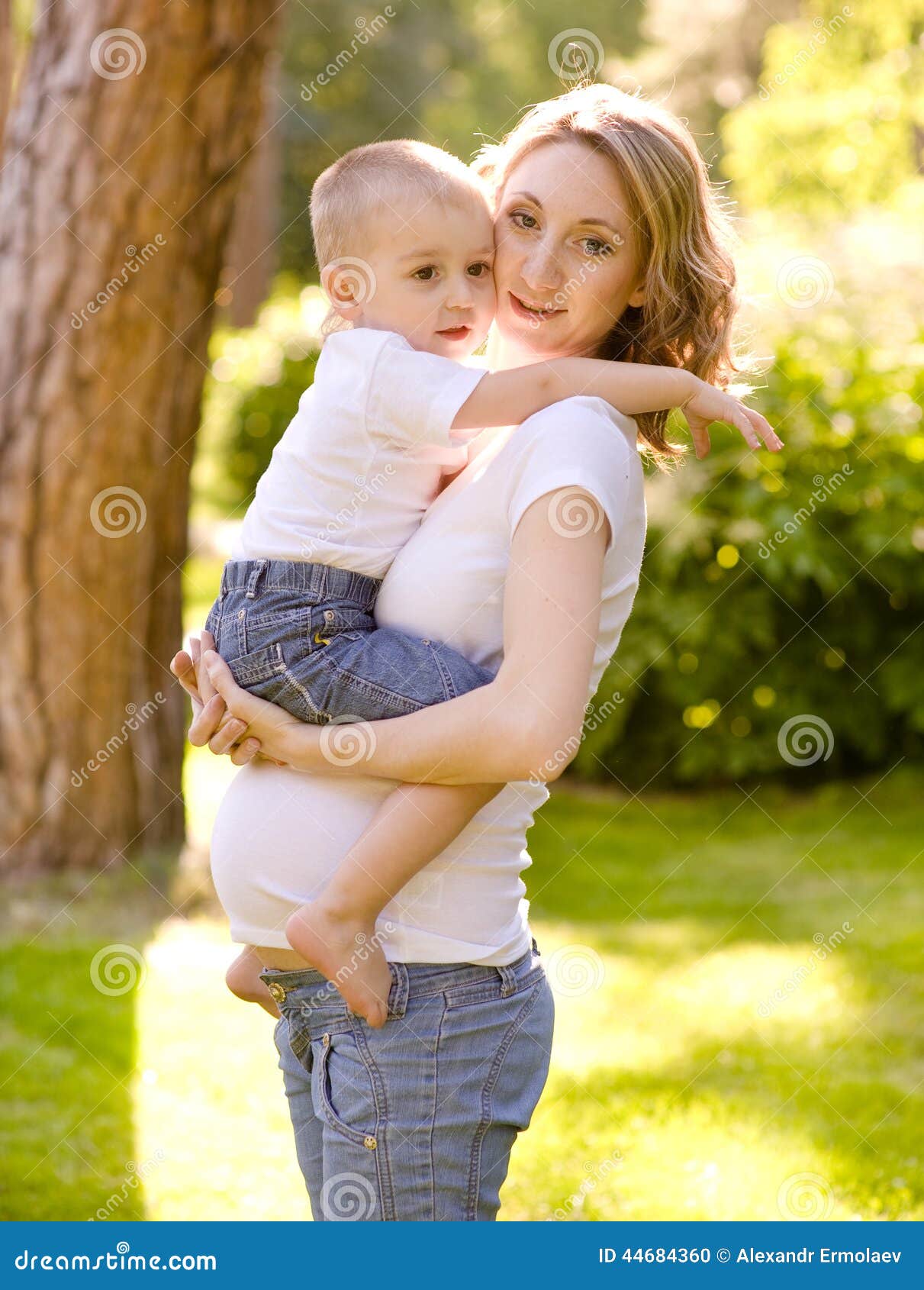 Pregnant Mother Hugging Her Son Stock Photo - Image of little, nature ...