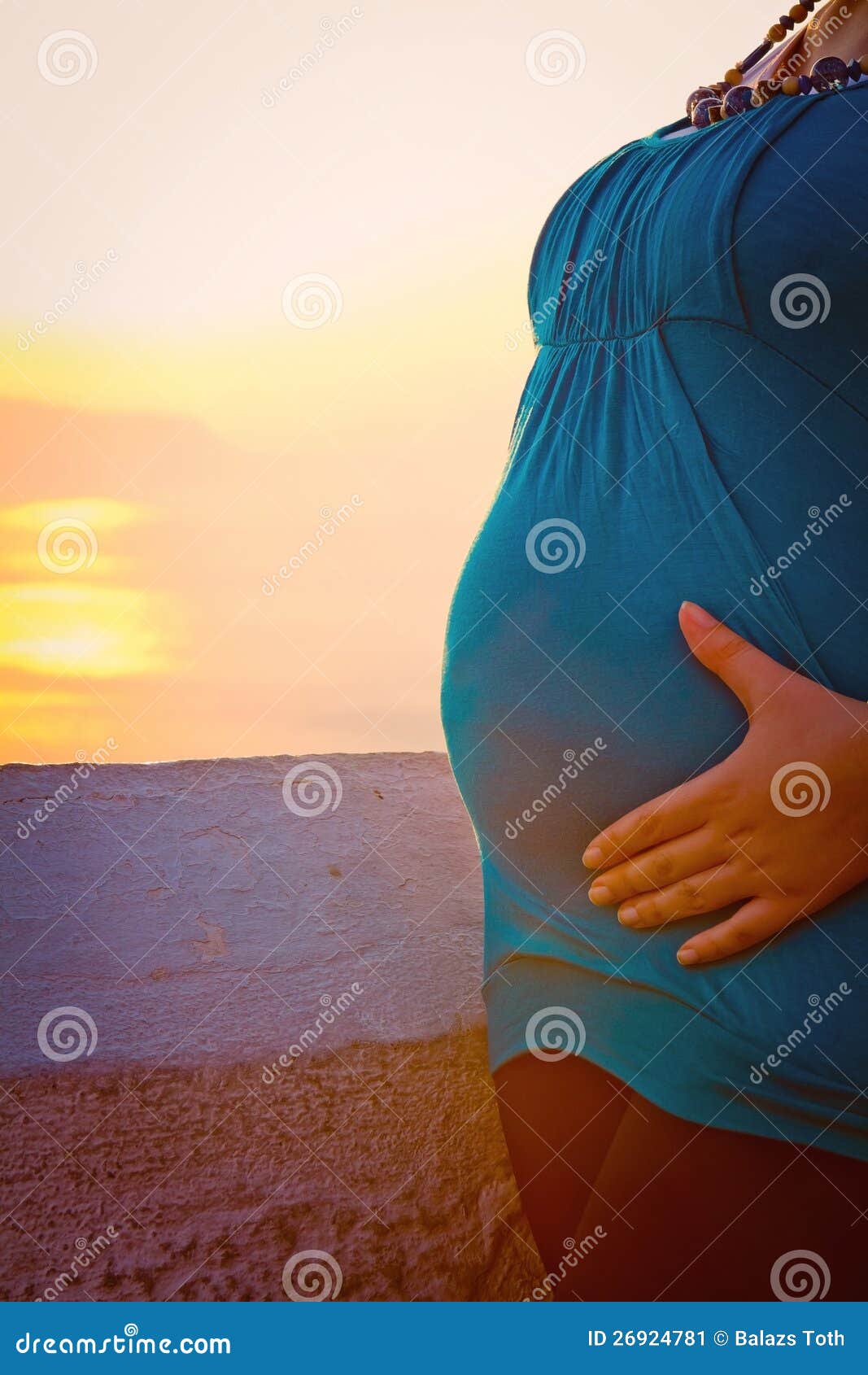 Pregnant Tummy in Sunset stock image. Image of orange - 26924781