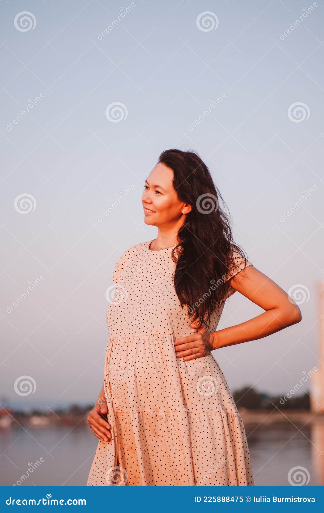 Pregnant Woman Against Background Of Nature Beautiful Young Asian