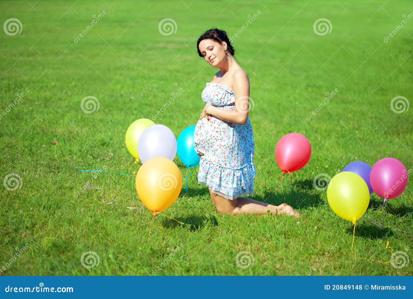 Pregnant Woman with Balloons on Grass Stock Photo - Image of colorful ...