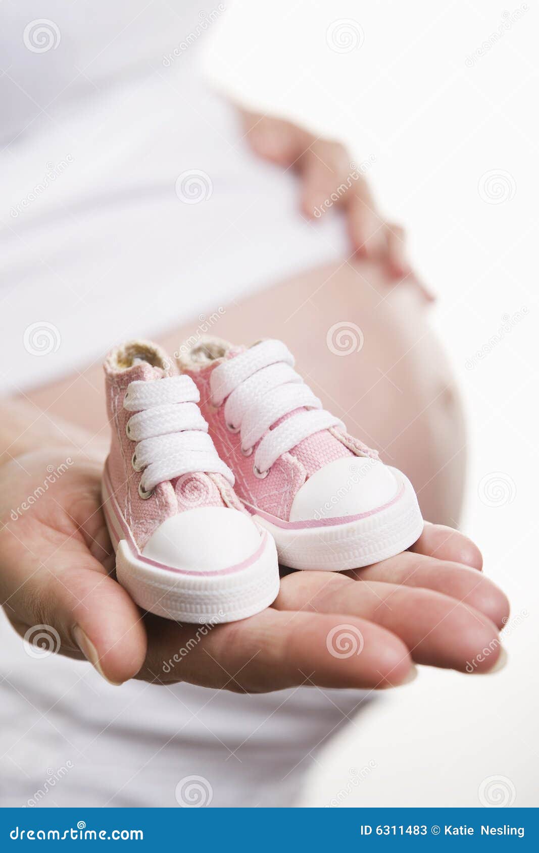 Pregnant Woman Holding Baby Shoes Stock Image - Image of cute, family ... Pregnant Woman Holding Baby Shoes Stock Image - Image of cute, family ...