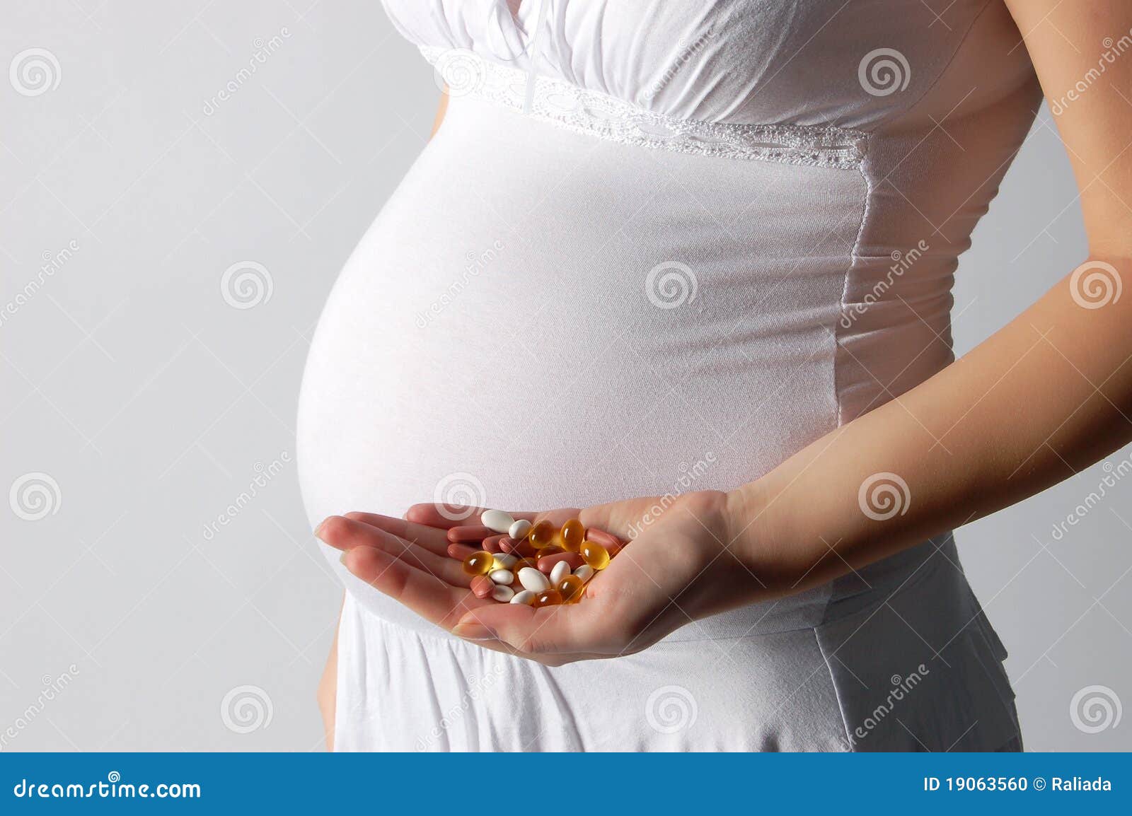 Pregnant Woman Holding Tablets Stock Photo - Image of stomach, tablets ...