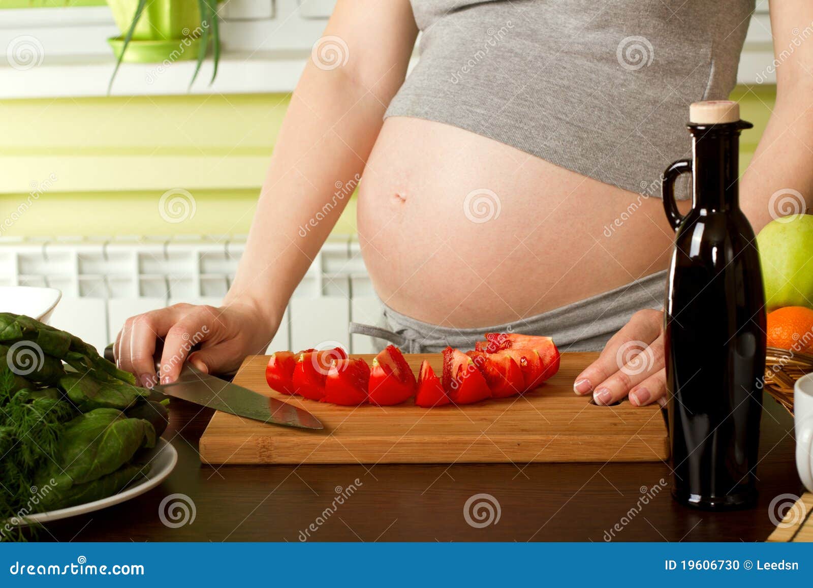 Pregnant woman on kitchen stock photo. Image of care - 19606730