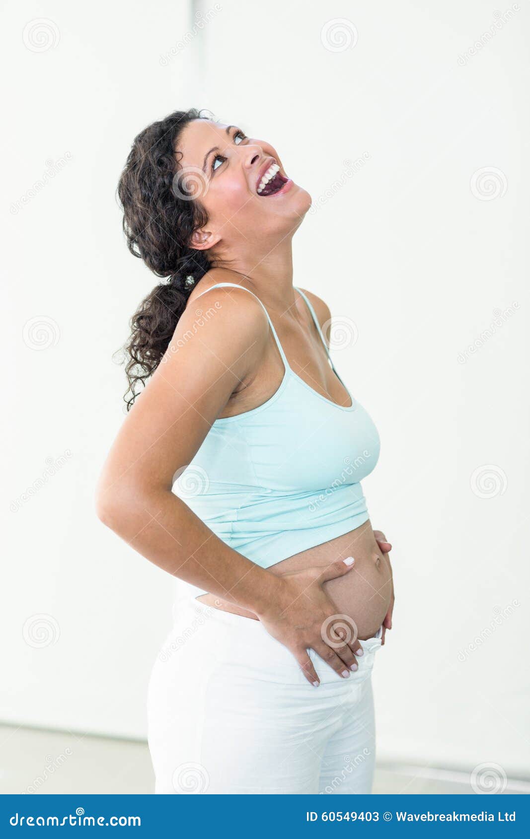Pregnant Woman Looking Up While Touching Her Belly Stock Image Image