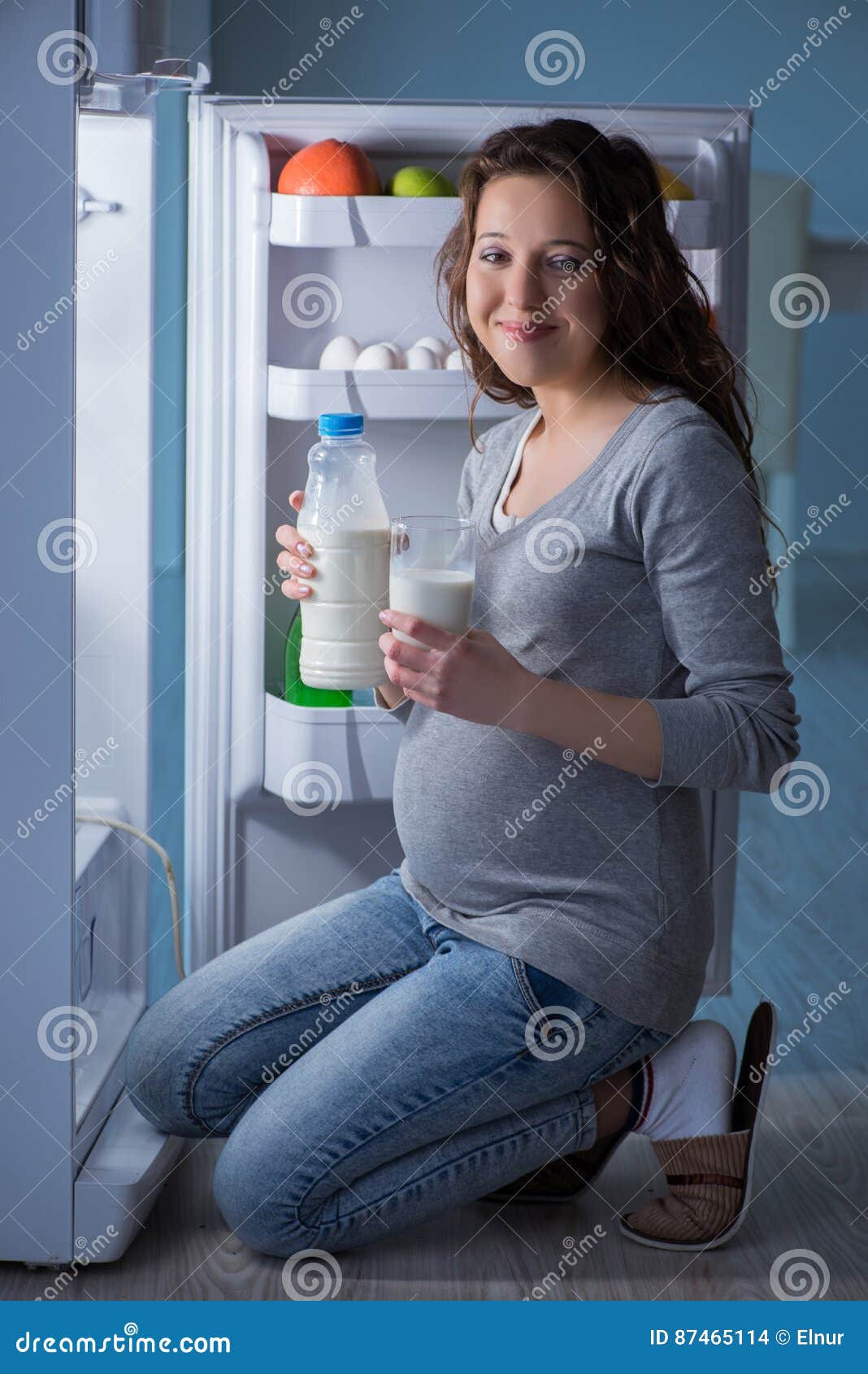 The Pregnant Woman Near the Fridge for Snacks and Food Stock Photo ... The Pregnant Woman Near the Fridge for Snacks and Food Stock Photo ...