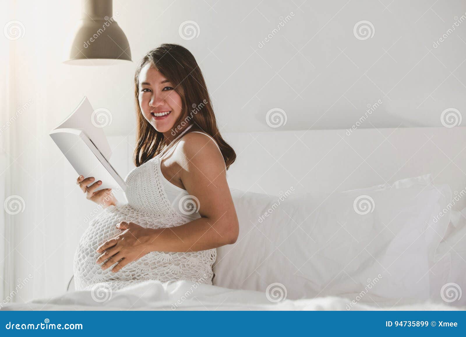 Pregnant Woman Reading A Book On A Bed At Home Stock Image Image Of