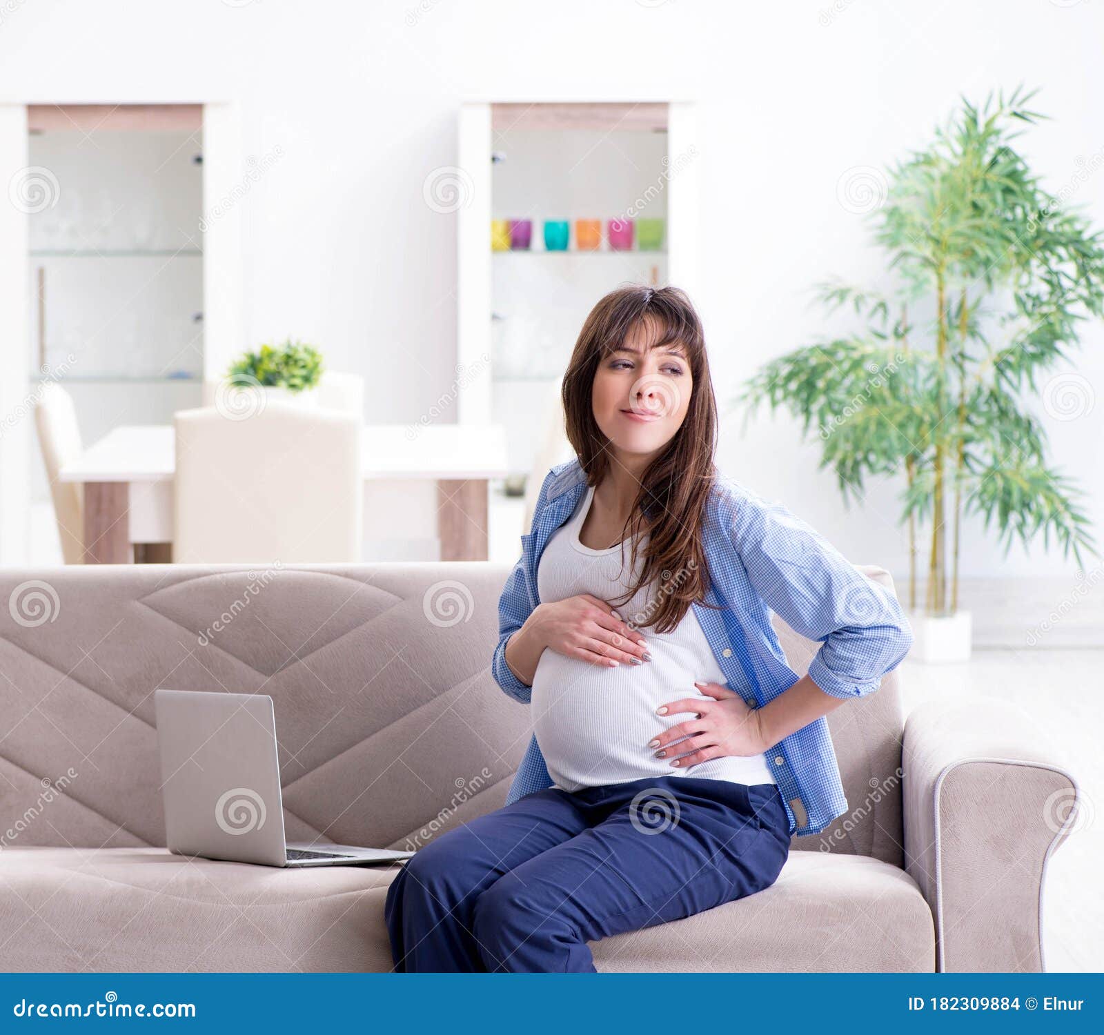 Pregnant Woman Relaxing on the Sofa Stock Photo - Image of holding ...