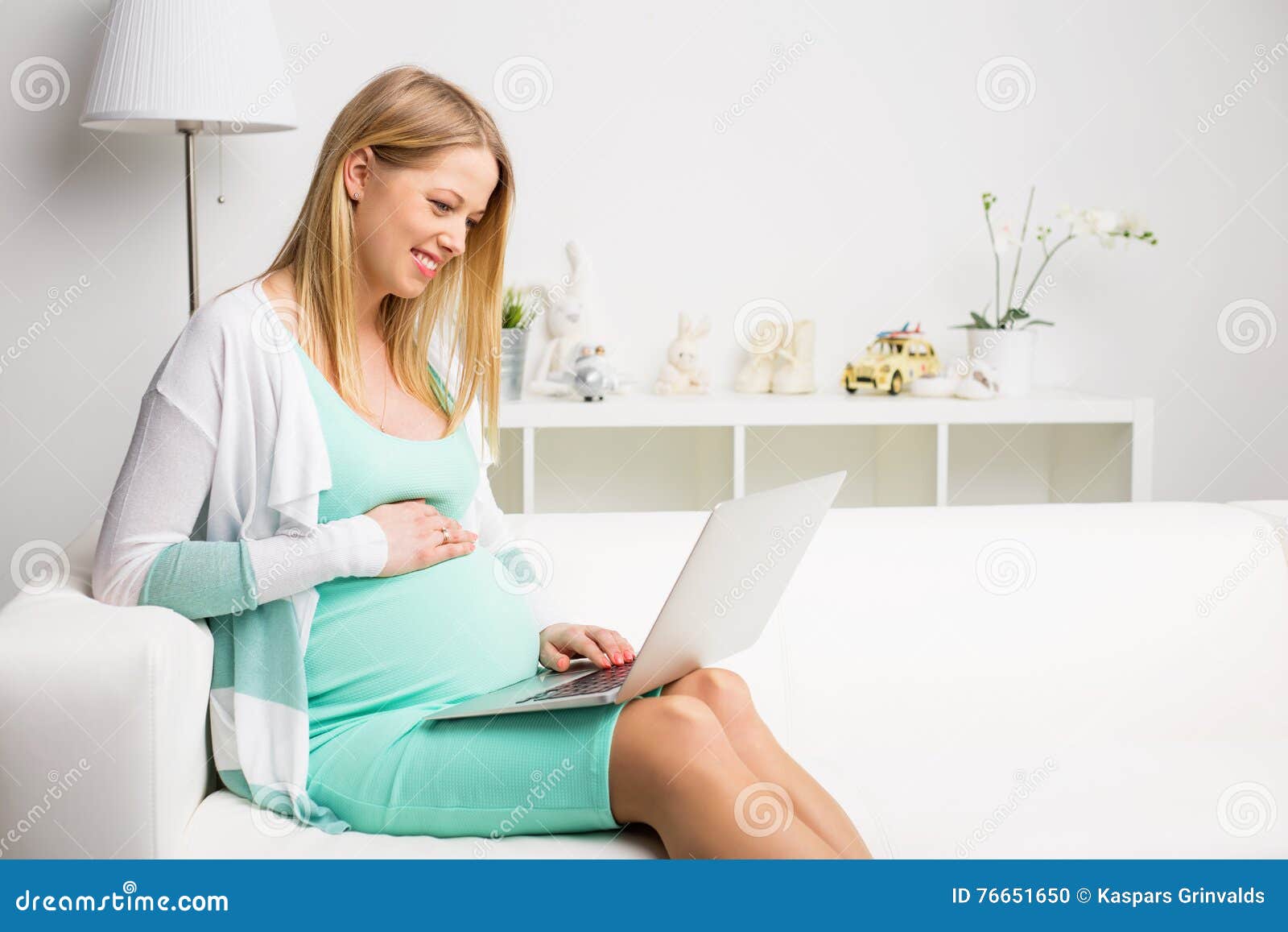 Pregnant Woman Sitting on Sofa and Using Computer Stock Photo - Image ...