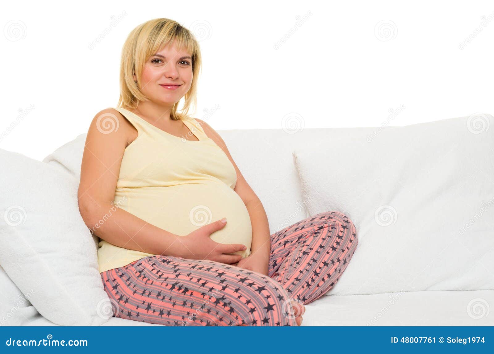 Pregnant woman on sofa stock image. Image of happy, portrait - 48007761