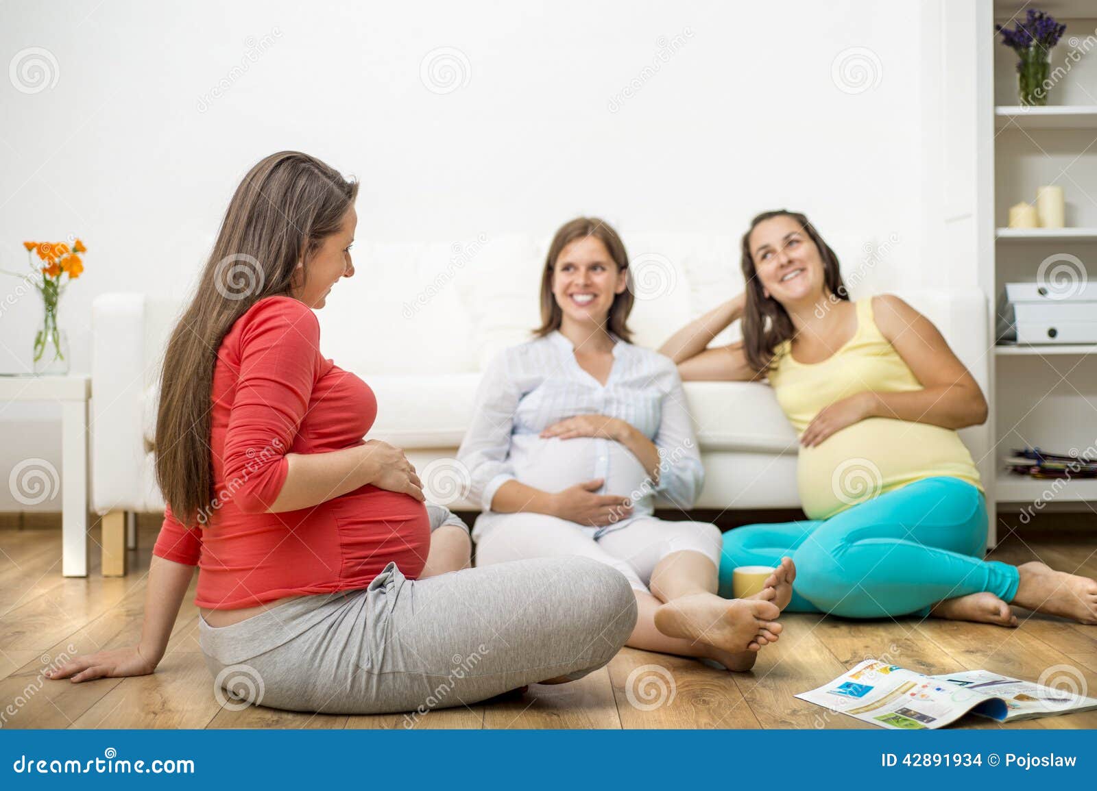 Pregnant women on sofa stock photo. Image of abdomen - 42891934