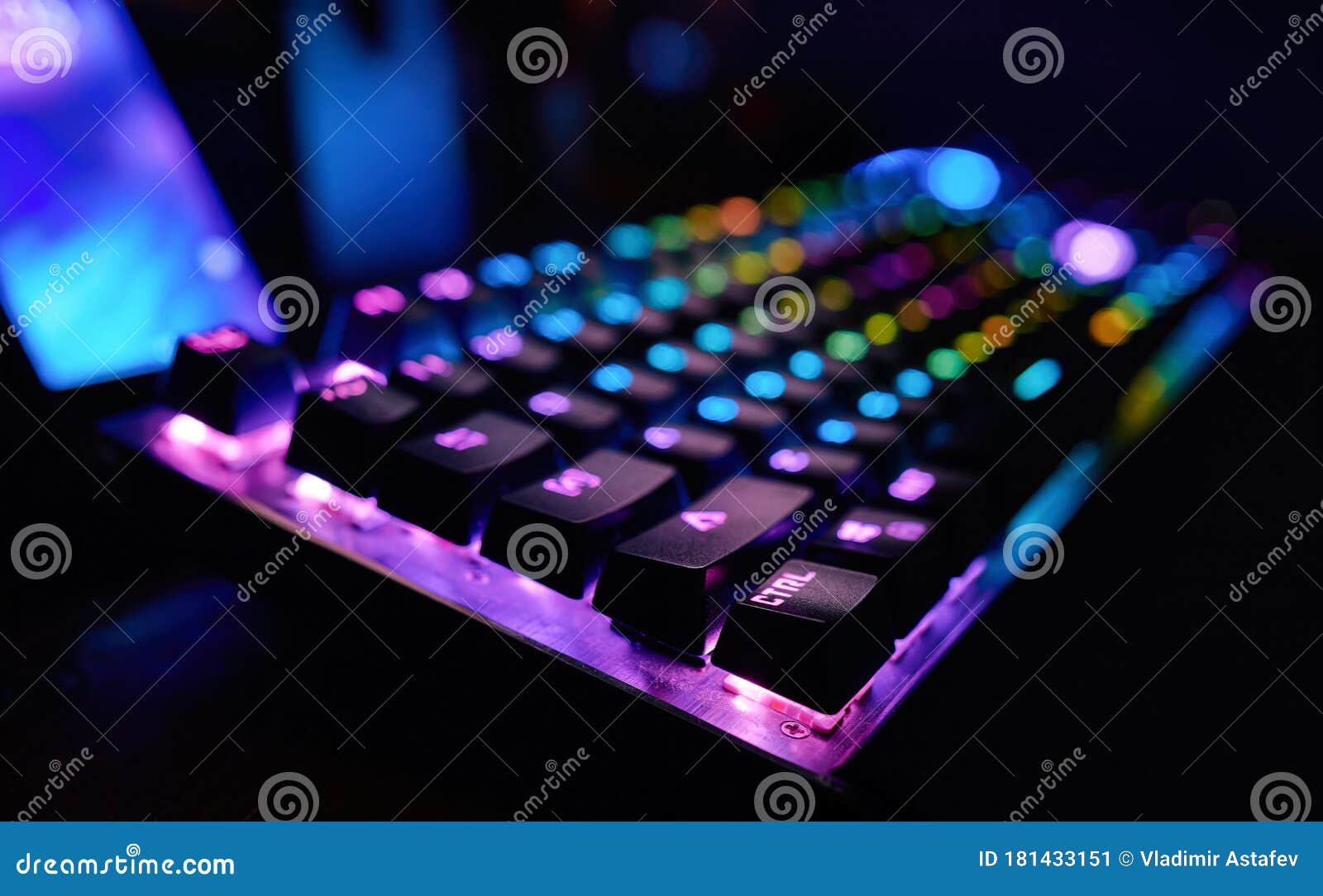 Premium Gaming RGB LED Backlit Keyboard. Mostly Purple and Blue. Side ...