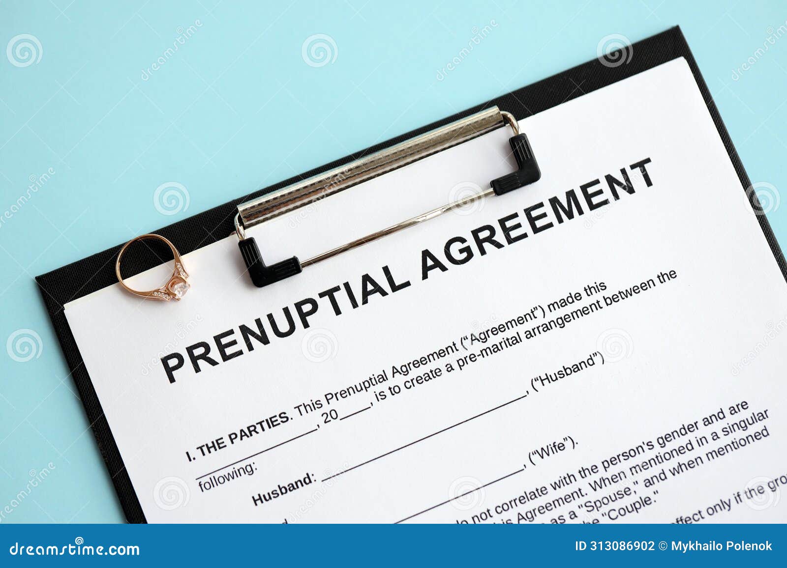 Prenuptial Agreement and Wedding Ring on Table. Premarital Paperwork ...
