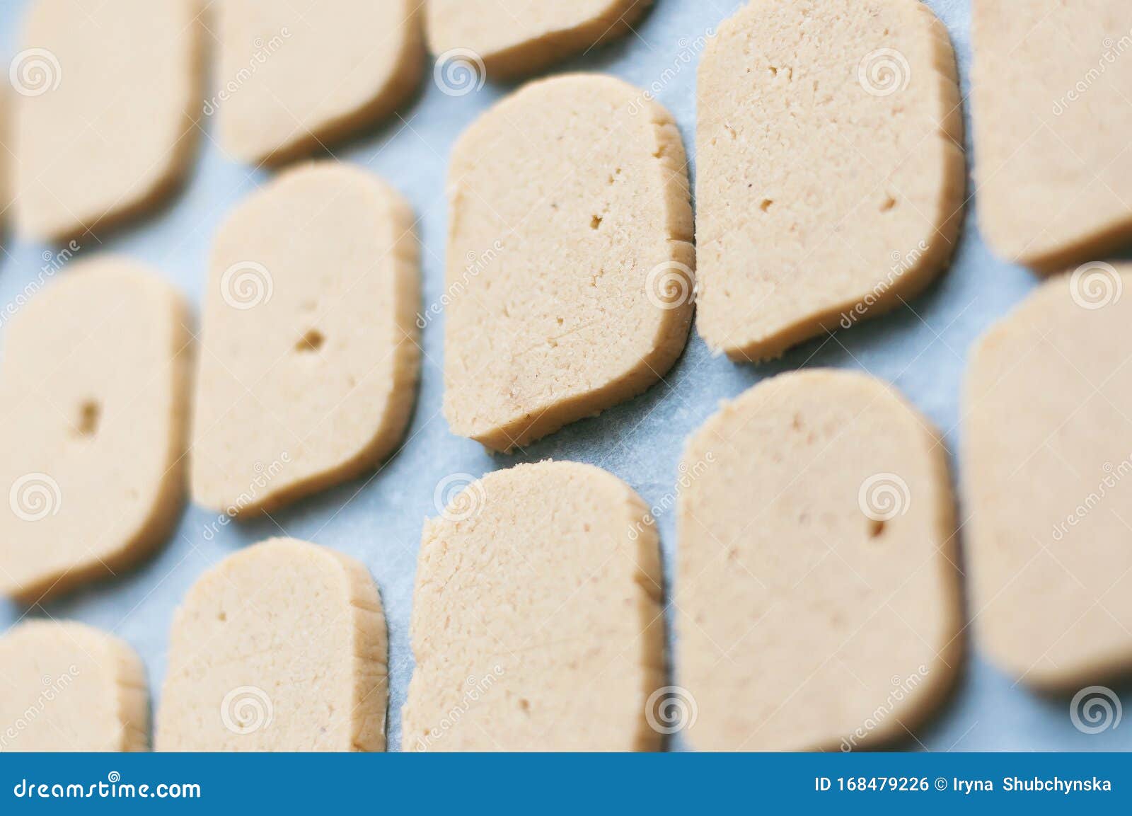 Preparation for Baking Cookies. an Even Row of Rectangular Raw Cookie ...