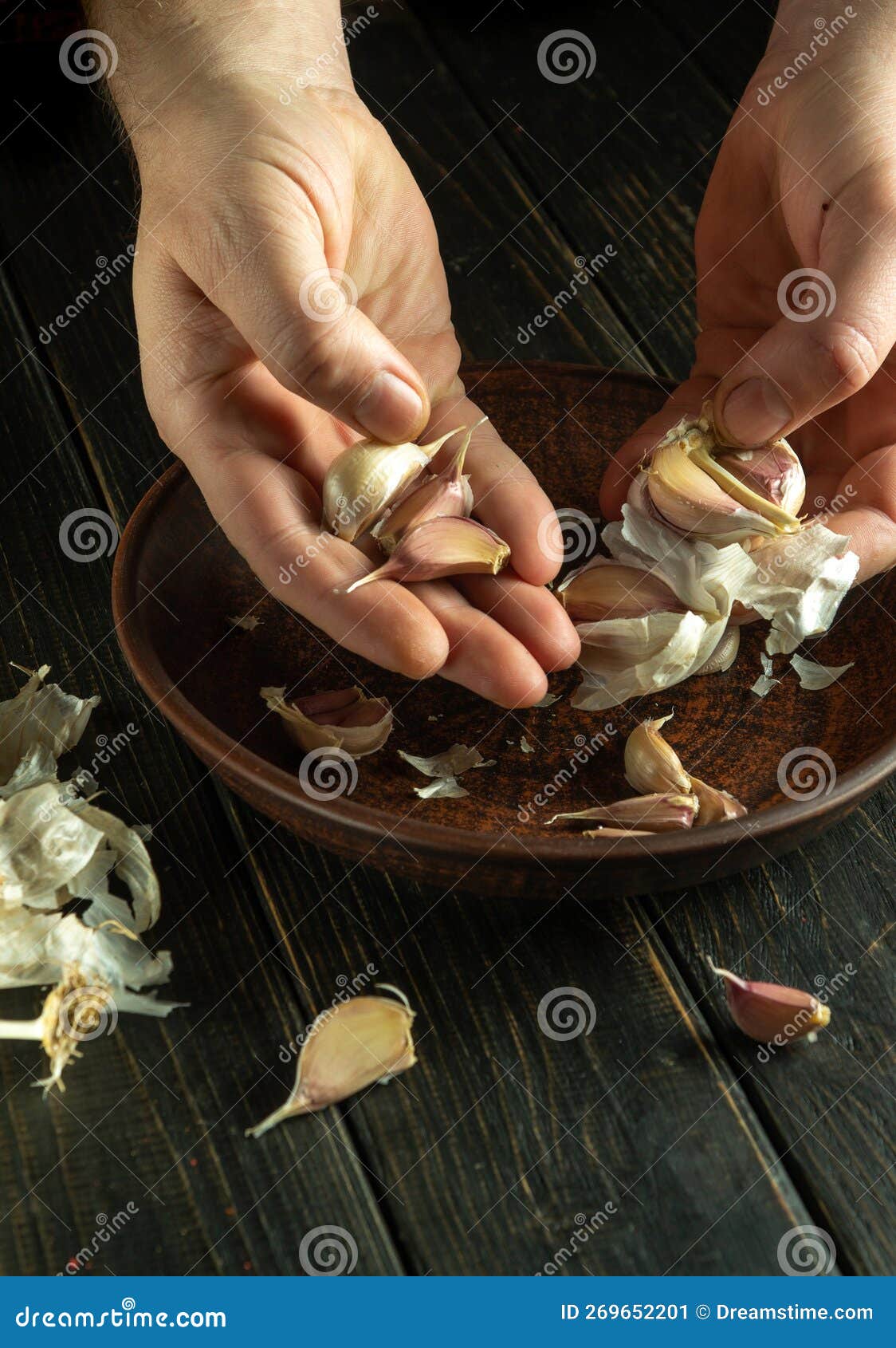 Preparation or Cleaning Garlic by the Hands of a Chef in the Restaurant ...