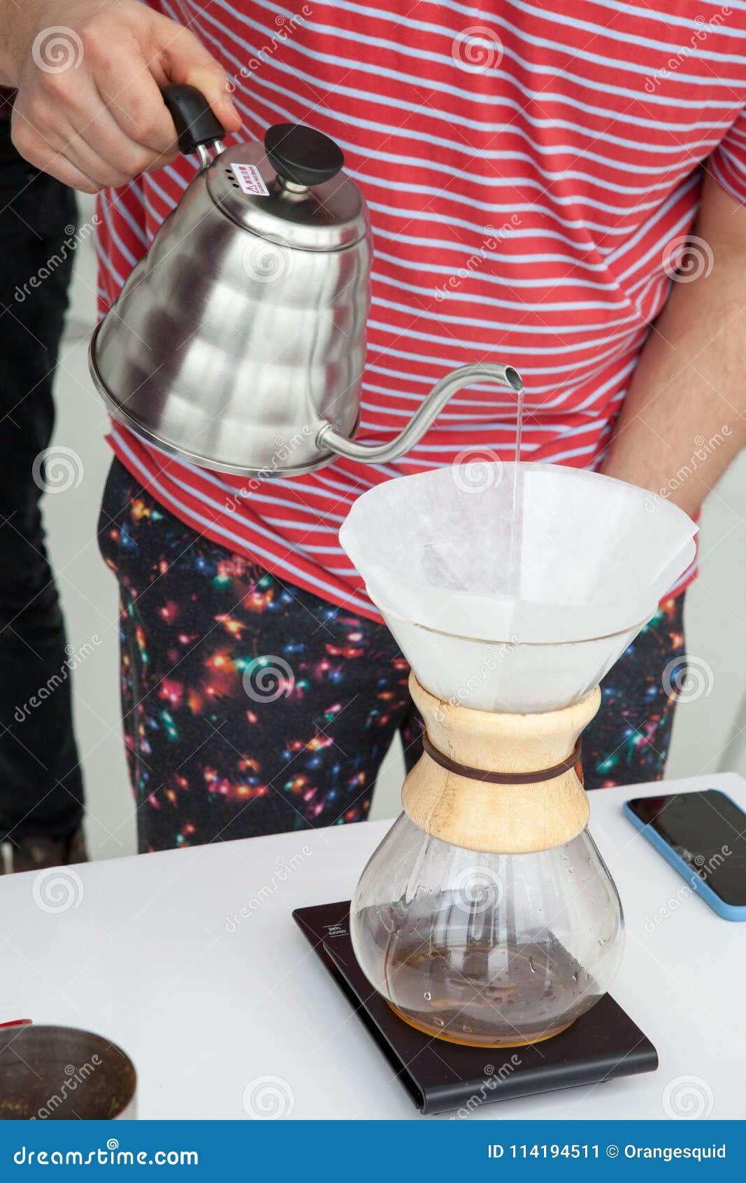 A Man is Preparing Coffee by a Method of Transfusion. Stock Image ...